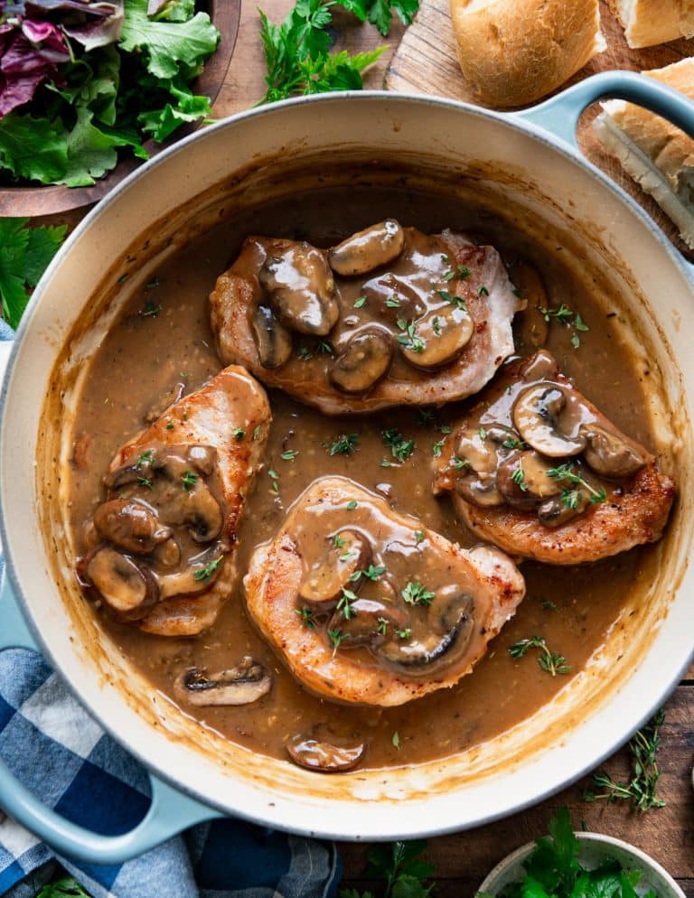 Easy Dutch Oven Pork Chops with Mushroom Gravy - The Seasoned Mom